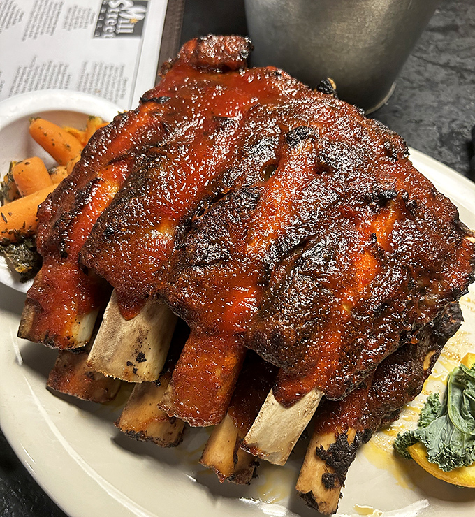 These ribs aren't just falling off the bone—they're practically jumping into your mouth, glazed with a sauce that balances sweet, tangy, and smoky in perfect harmony.