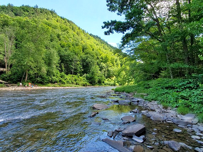 Smooth stones and clear waters create nature's most inviting playground. Wade in or skip stones—either way, you're doing summer right.