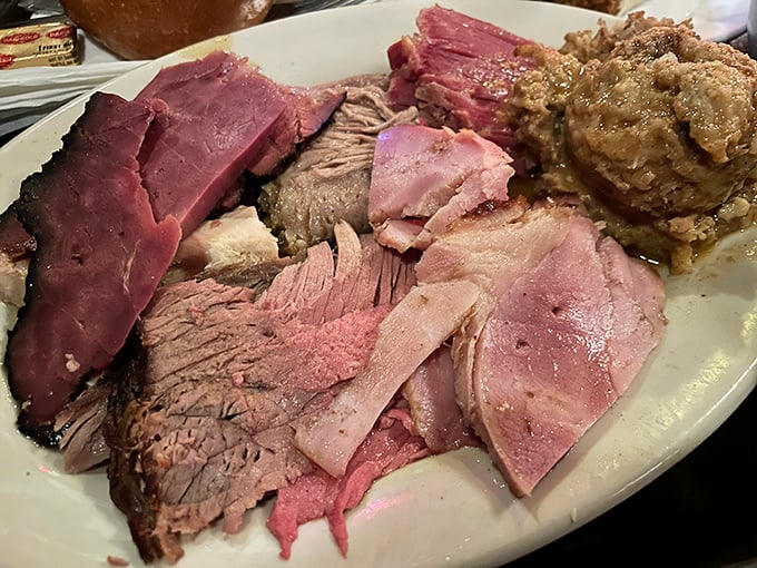 The roast beef sandwich: pink in the middle, piled high, and proof that sometimes the simplest pleasures are the most profound.