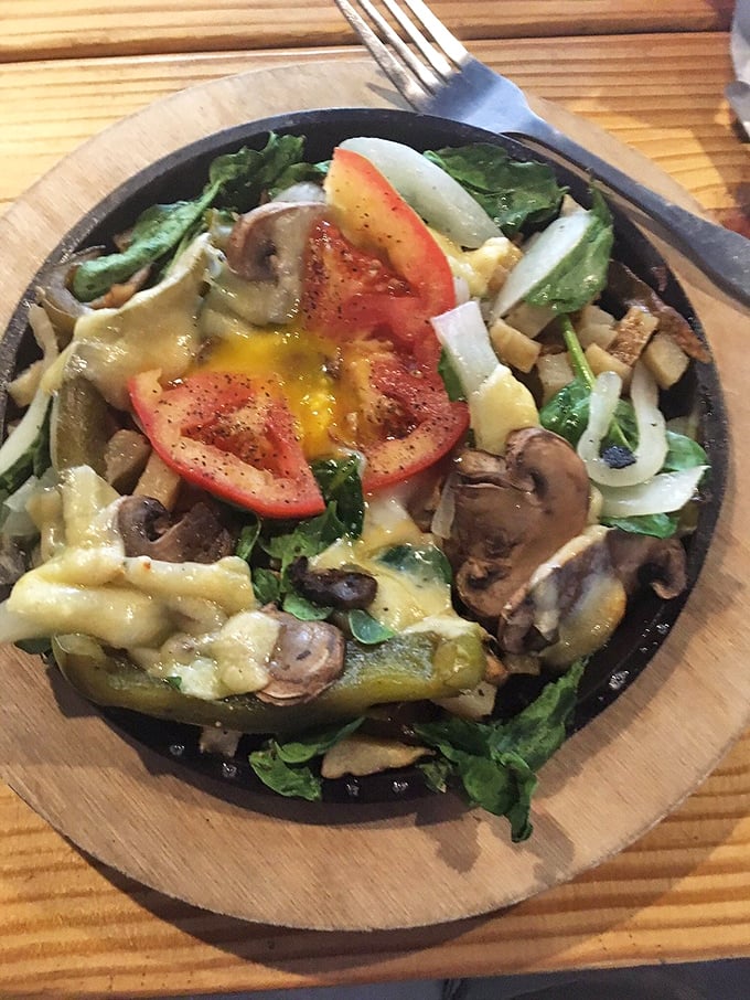 Even the salads here mean business, with fresh greens, sautéed mushrooms, and melted cheese creating a dish that makes eating vegetables feel like cheating.