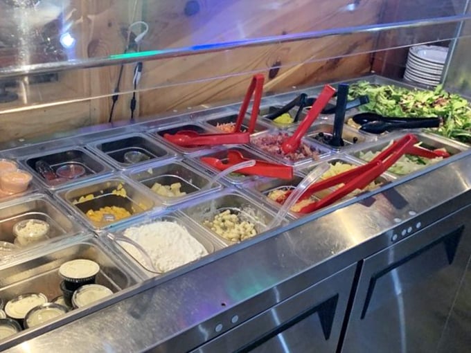 The fixings bar – where your barbecue plate gets its supporting cast. Fresh toppings and house-made sides waiting to complement that smoky main character.