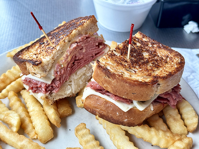 This isn't just a sandwich—it's architectural genius. Layers of corned beef, sauerkraut, and melted cheese between perfectly grilled rye bread.