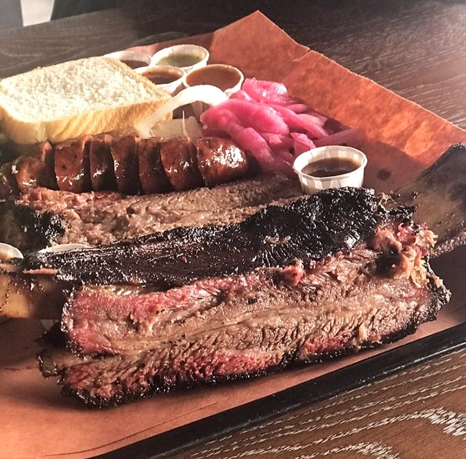 Meat candy on a plate. These beef ribs and brisket have been smoking longer than some rock bands, and it shows in every succulent bite.