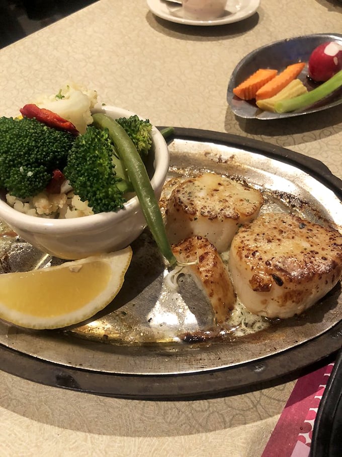 Seared scallops that could make a seafood skeptic swoon, served with vegetables that didn't travel halfway around the world to reach your plate.