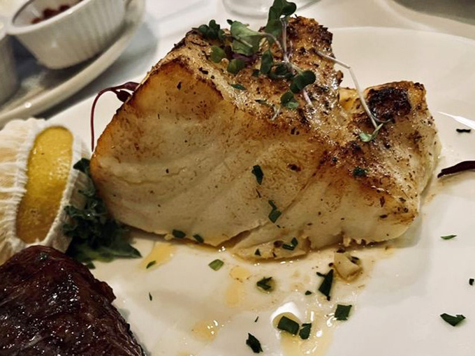 Sea bass so perfectly seared it practically has a resume. The delicate herbs and butter sauce? Just showing off at this point.