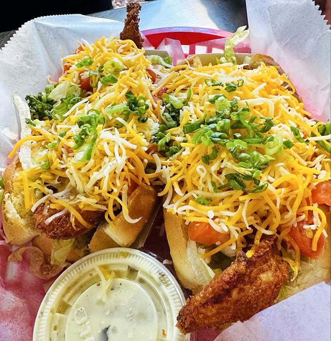 The seafood equivalent of hitting the jackpot – crispy fish nestled in soft rolls, crowned with cheese and fresh scallions.
