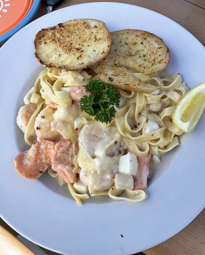 Seafood pasta that doesn't skimp on the stars of the show—plump shrimp and tender fish swimming in a sea of perfectly cooked fettuccine.