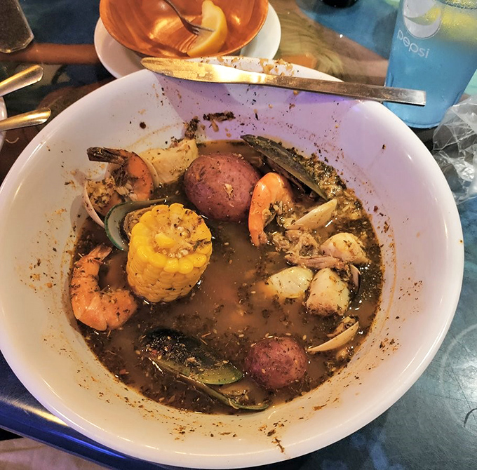 A seafood boil that's basically a treasure hunt in a bowl—corn, potatoes, shrimp, and spices creating the kind of aromatic magic that turns heads.
