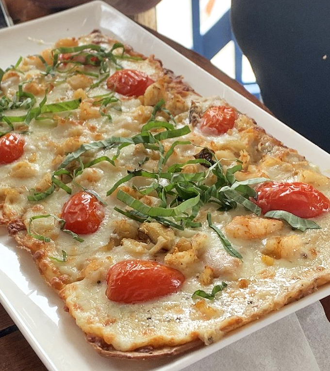 Who needs traditional pizza when flatbreads like this exist? Fresh seafood, roasted tomatoes, and herbs create a light yet satisfying flavor explosion.