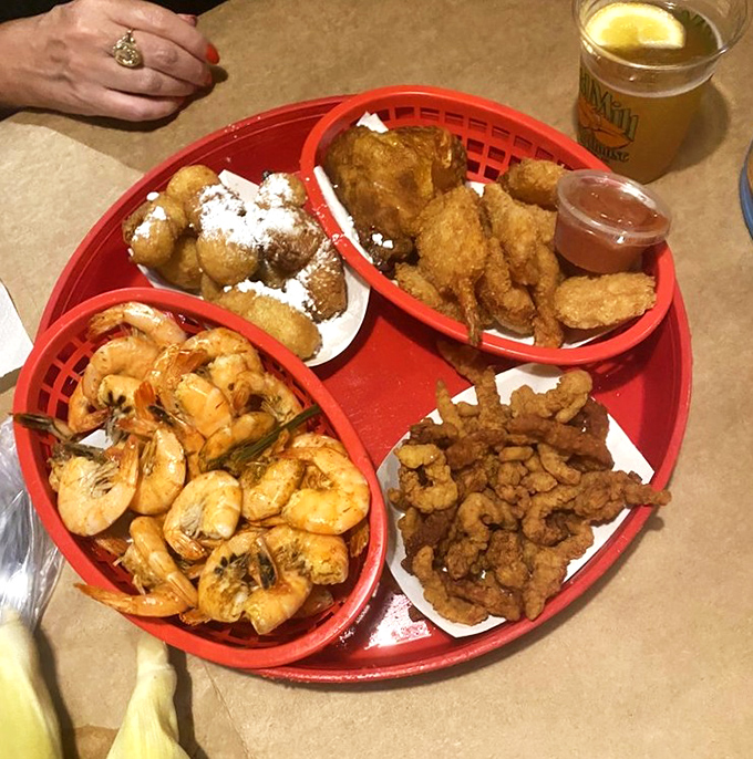 This seafood platter isn't just a meal—it's a maritime festival where shrimp, hush puppies, and fried delights compete for your attention.