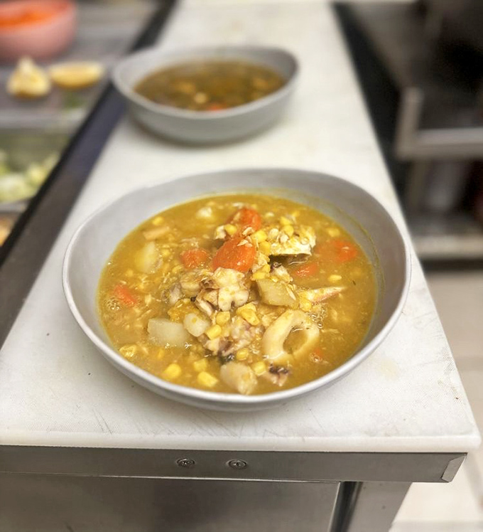 This seafood soup isn't just broth with stuff floating in it—it's a Caribbean sea in a bowl, minus the sand in uncomfortable places.