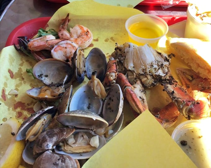 The seafood combo is like Ocean's Greatest Hits on a plate. Clams, crab, and prawns playing in perfect harmony with garlic, herbs, and white wine.