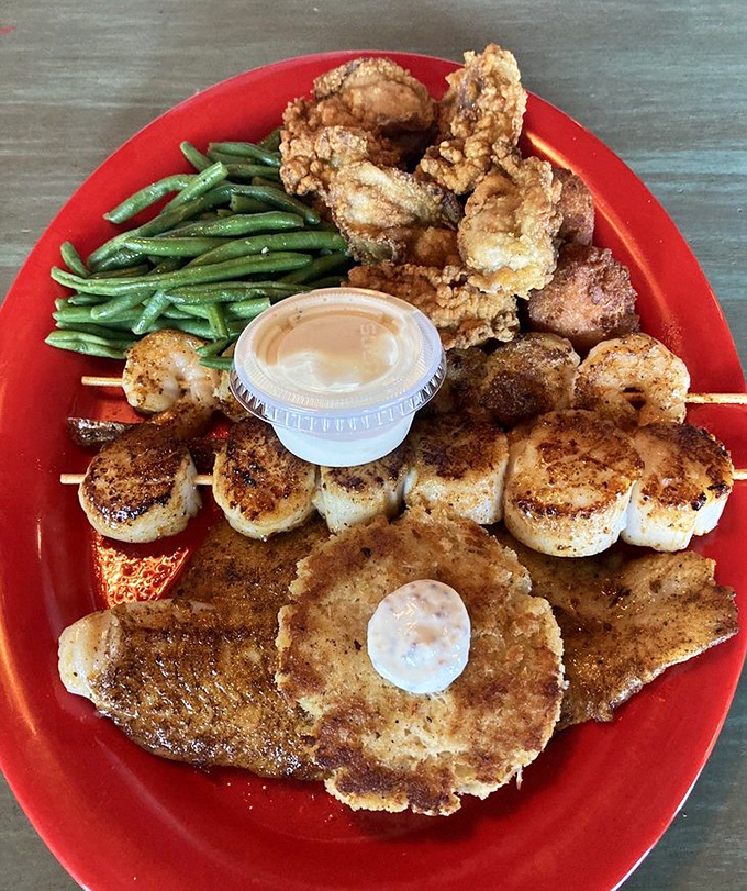 A seafood sampler that hits all the right notes – crispy, savory, and fresh. The green beans provide the illusion of healthfulness we all need.