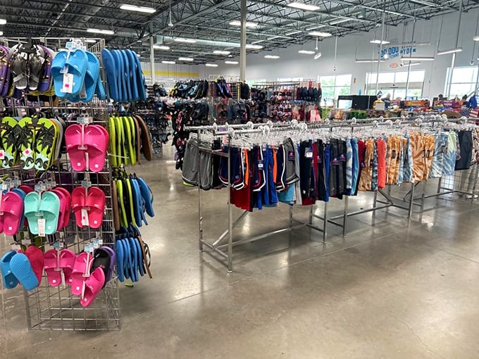 Summer essentials line these racks, where beach-ready shorts and colorful flip-flops await their next sunny adventure.