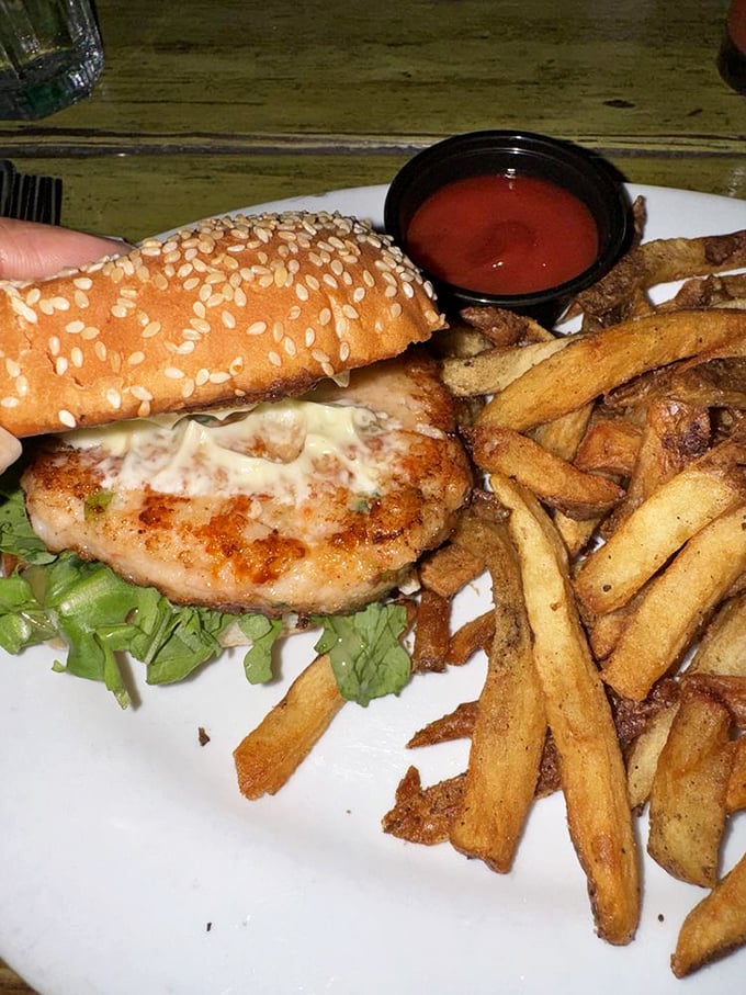 This isn't just a burger—it's a handheld masterpiece of perfectly seasoned protein, crisp lettuce, and hand-cut fries that deserve their own fan club.