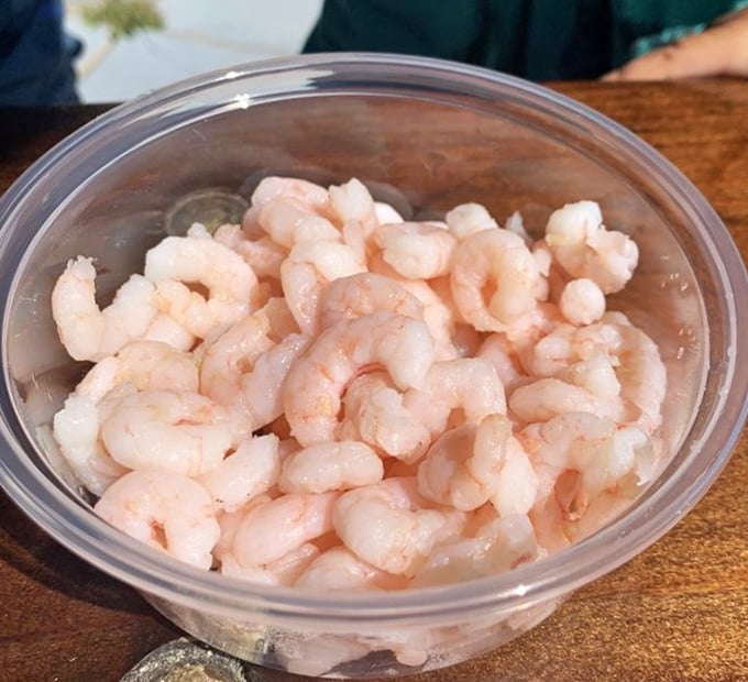 These bay shrimp are having their glamour shot moment – plump, pink, and ready for their close-up before their delicious destiny.
