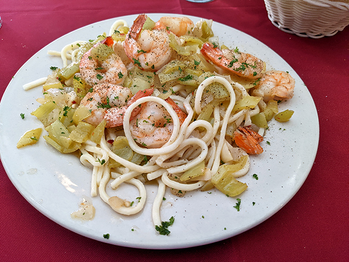 The legendary shrimp scampi—where plump crustaceans and al dente pasta perform a perfectly choreographed dance in garlic butter.