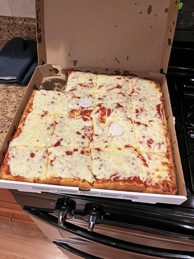 The Sicilian square pie – a cheese lover's dream with perfect crust-to-topping ratio. Proof that sometimes the classics need no improvement.