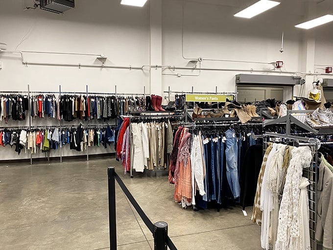 The clothing section stretches like a textile library, each garment cataloged by type and size, waiting for its next chapter to begin.