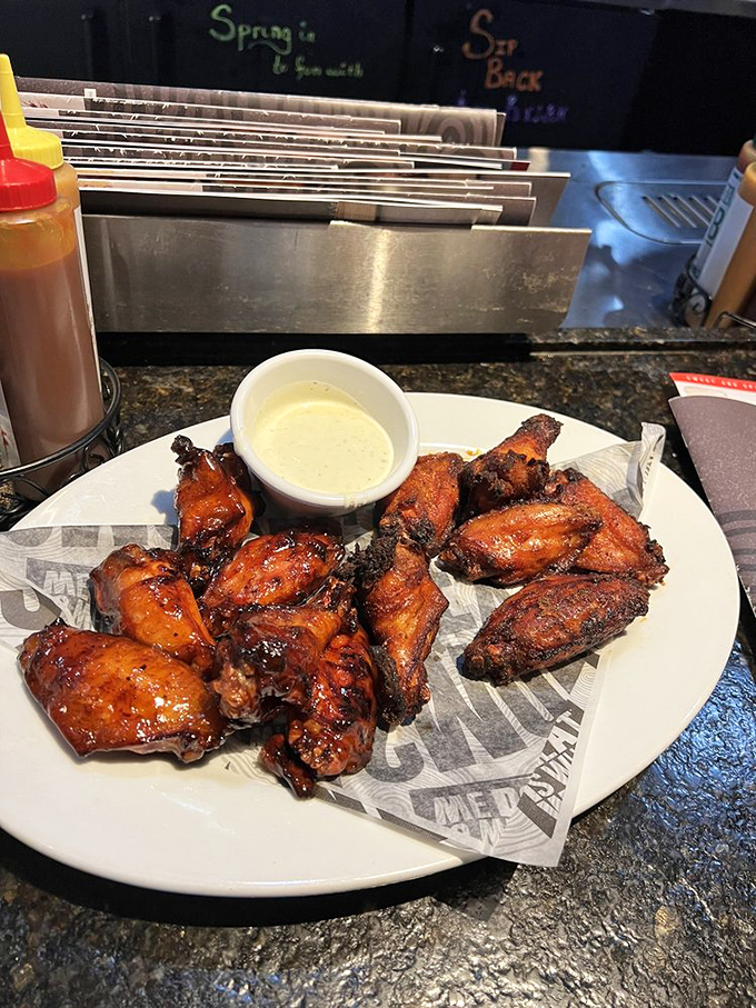 These wings didn't skip arm day—substantial, glistening with sauce, and demanding to be eaten with your hands, dignity be damned.