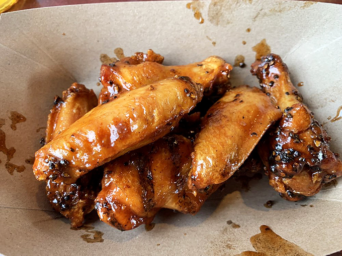 Wings that have clearly been introduced to smoke and fire in the most delicious way possible. Finger-licking isn't optional—it's mandatory.