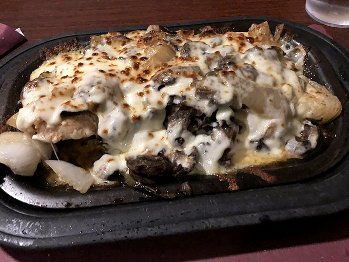 Cheese-smothered goodness sizzling on a hot plate. When Wisconsin decides to blanket something in melted cheese, magic happens.