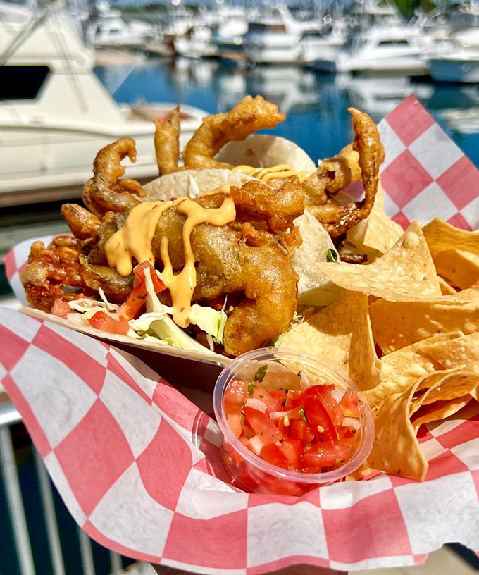 Soft shell crab tacos with marina views – the kind of dish that makes you question why you'd ever eat anything else near the ocean.