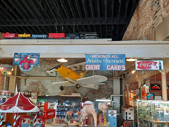 Neon signs and vintage gas pumps—the perfect backdrop for that alien head. ET would feel right at home in this retro wonderland.