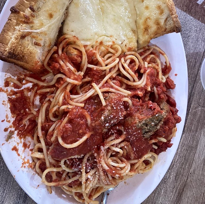 Spaghetti with meatballs and garlic bread – the comfort food equivalent of a warm hug from your favorite Italian grandmother.