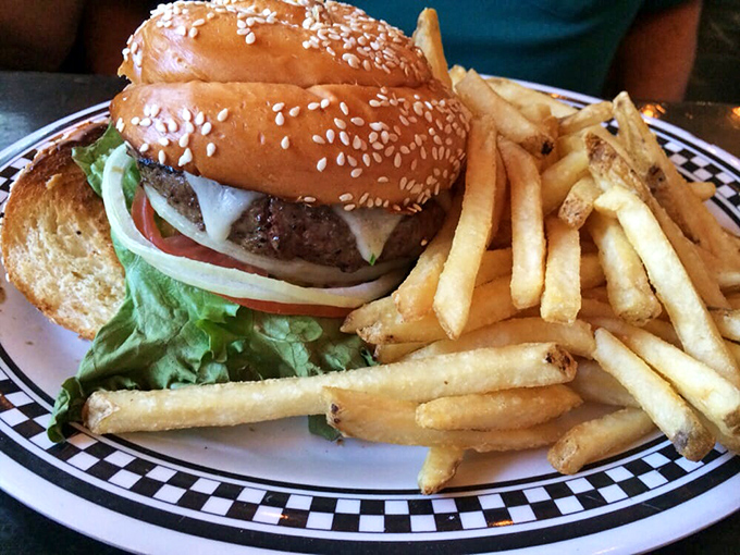 Even the burger gets the New York treatment. That sesame-studded bun, those fresh toppings—it's like Central Park on a plate, minus the pigeons.