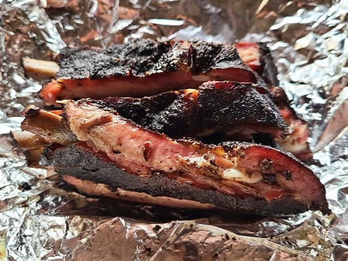 These ribs aren't "falling off the bone"—and that's exactly right. Perfect barbecue ribs should cling until your teeth say otherwise.