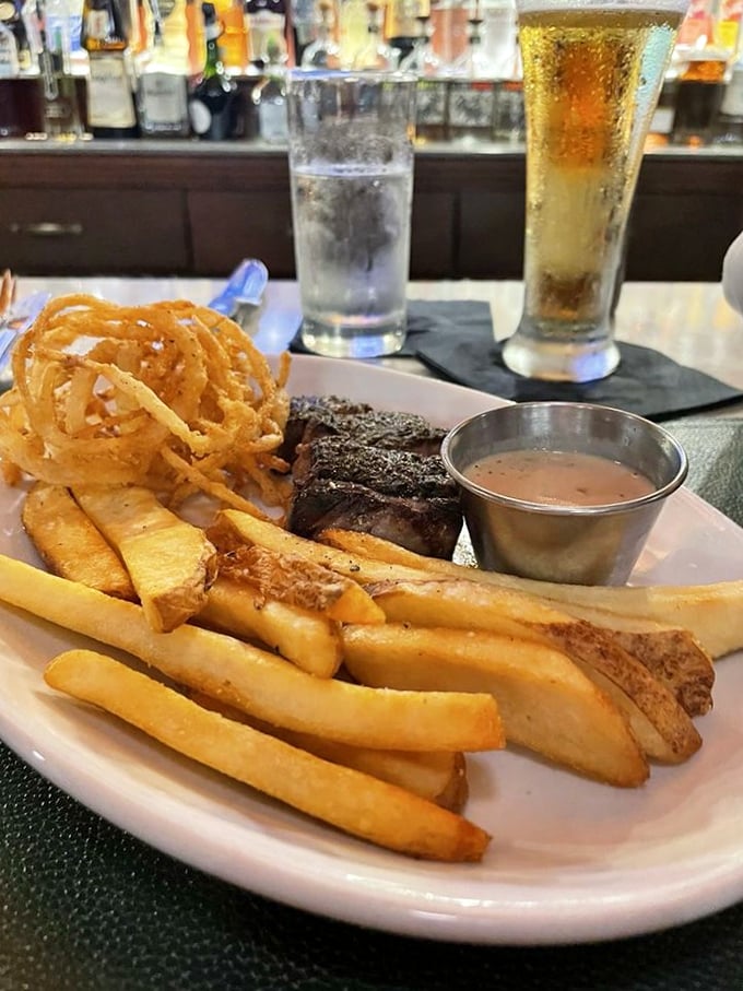 This isn't just dinner—it's a carnivore's dream vacation. Steak, fries, and onion rings: the holy trinity of comfort food, elevated to art form.