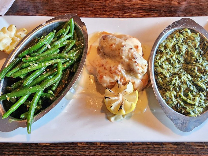 A seafood trifecta that would make Neptune jealous—perfectly cooked fish flanked by vibrant green beans and something deliciously creamy.