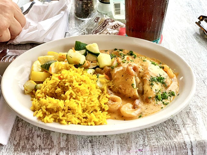 This seafood dish isn't just dinner – it's edible artwork, where creamy sauce meets tender fish and colorful vegetables in perfect harmony.