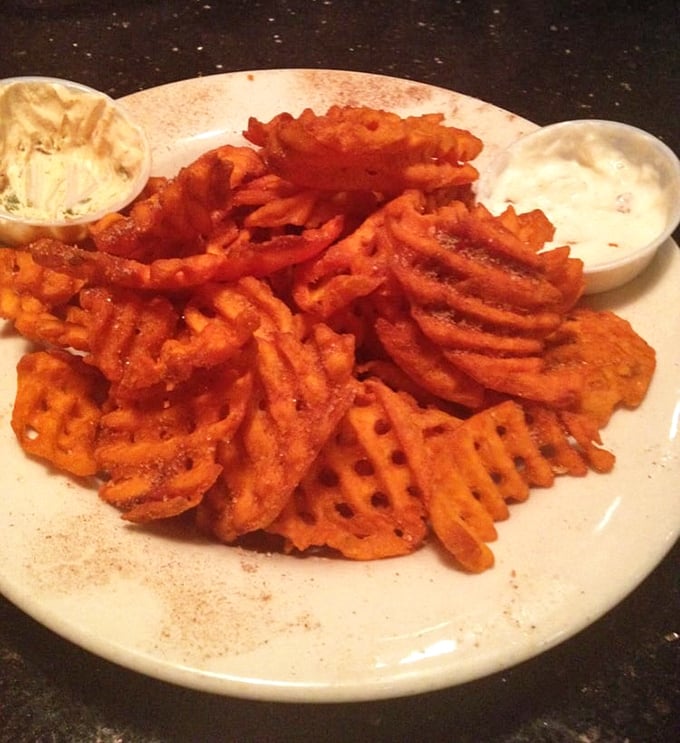 Sweet potato waffle fries that somehow manage to be both crispy and tender—like the best relationships. The perfect sauce-delivery system.