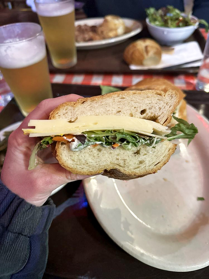 The Swiss cheese sandwich—proof that sometimes the simplest combinations create the most satisfying outcomes, like Lennon and McCartney for your mouth.