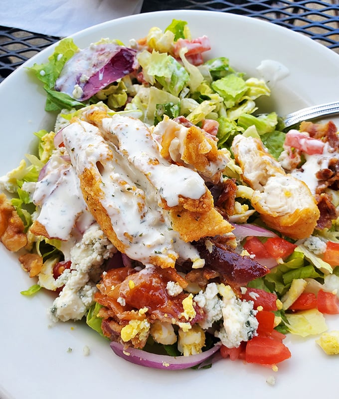 A salad that doesn't apologize for being delicious – loaded with enough goodies to make you forget you ordered something healthy.