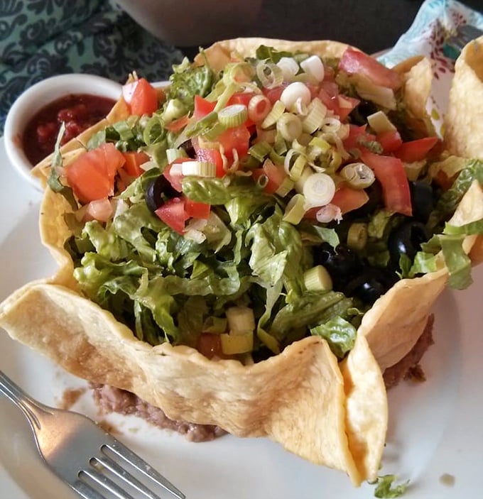 Not your average taco salad – this edible bowl cradles a garden party where every vegetable is dressed for success and ready to mingle.