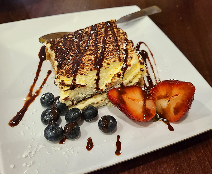 Tiramisu that's dressed for success with chocolate drizzle and fresh berries. It's the dessert equivalent of a perfectly tailored Italian suit.