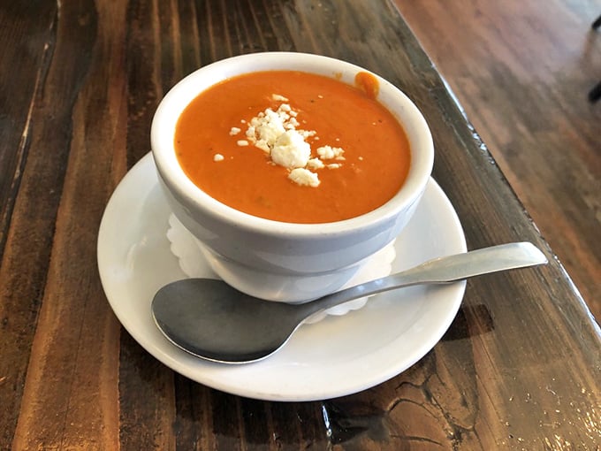 Tomato bisque that proves soup isn't just a supporting actor—it's ready for its starring role with that perfect crown of cheese.