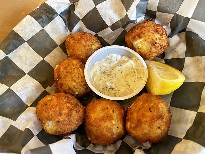 These trout fritters look like they're auditioning for the Seafood Hall of Fame – crispy, golden orbs of fish and potato that could convert even the most dedicated fish skeptic.