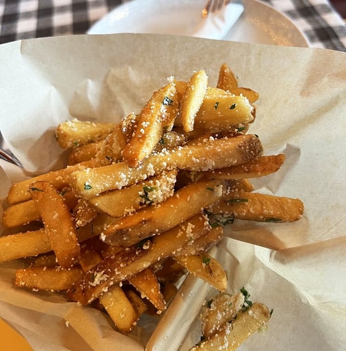 These aren't just fries—they're potato aristocracy, dressed in their finest cheese attire and perfumed with truffle oil for their grand appearance at your table.