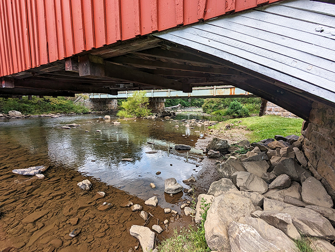 Beneath the bridge, Laurel Hill Creek continues its patient journey, just as it did when horse-drawn carriages crossed overhead instead of cars.