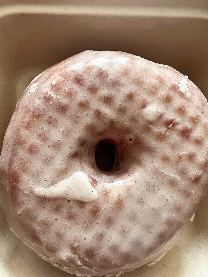 The vanilla bean glazed donut – deceptively simple, devastatingly delicious. This isn't your gas station vanilla donut; this is vanilla elevated to an art form.