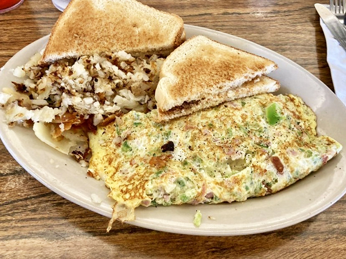 This Western omelet doesn't just speak of morning promise—it shouts it. Paired with home fries that could make a potato farmer weep with pride.
