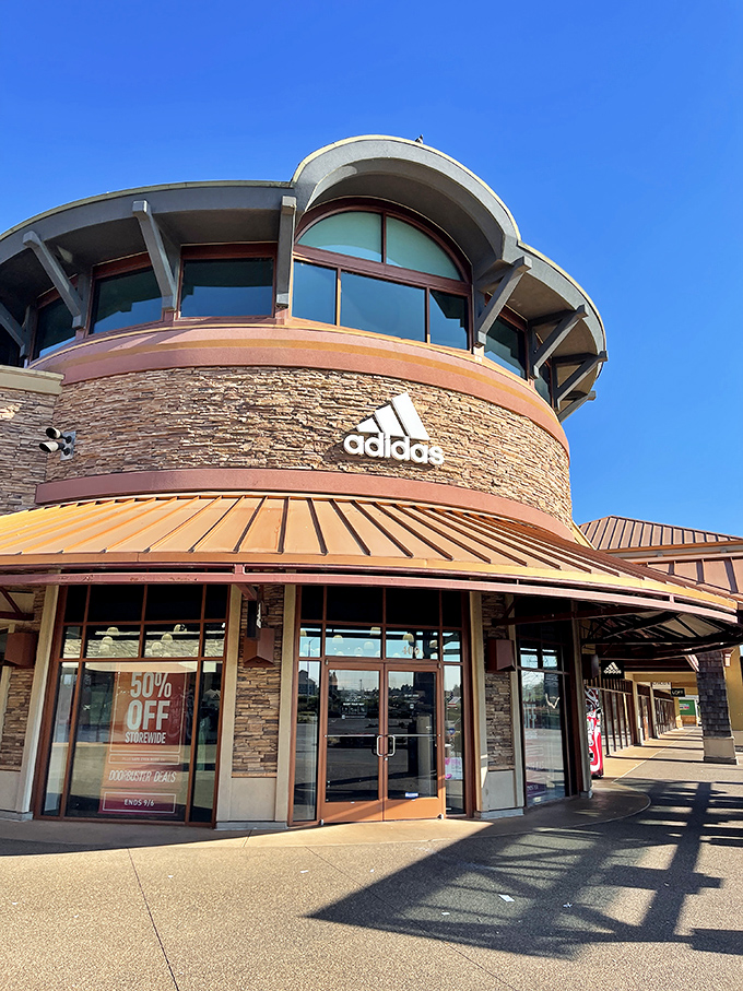 The Adidas store's distinctive architecture makes it impossible to miss—much like that 50% OFF sign that's practically calling your name.