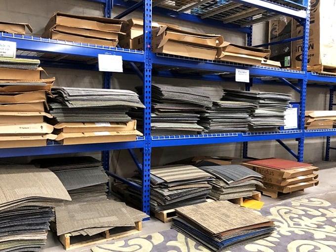 The carpet square collection rivals any paint swatch display, offering DIY flooring enthusiasts endless possibilities for mixing and matching.
