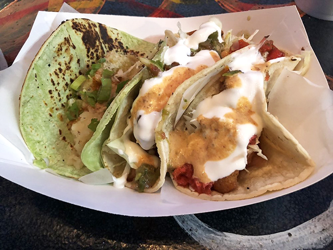 Two tacos, infinite possibilities. Each one customized at the legendary condiment bar—the place where good tacos become unforgettable ones.