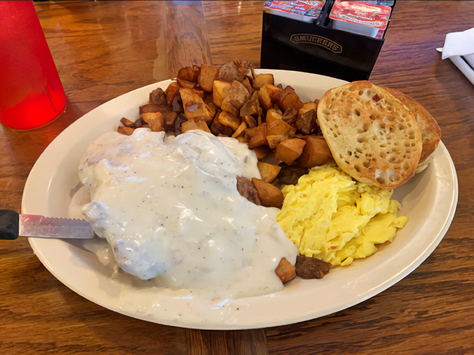 These biscuits and gravy are what Southern dreams are made of—a perfect cloud of carbs swimming in a sea of peppery comfort.