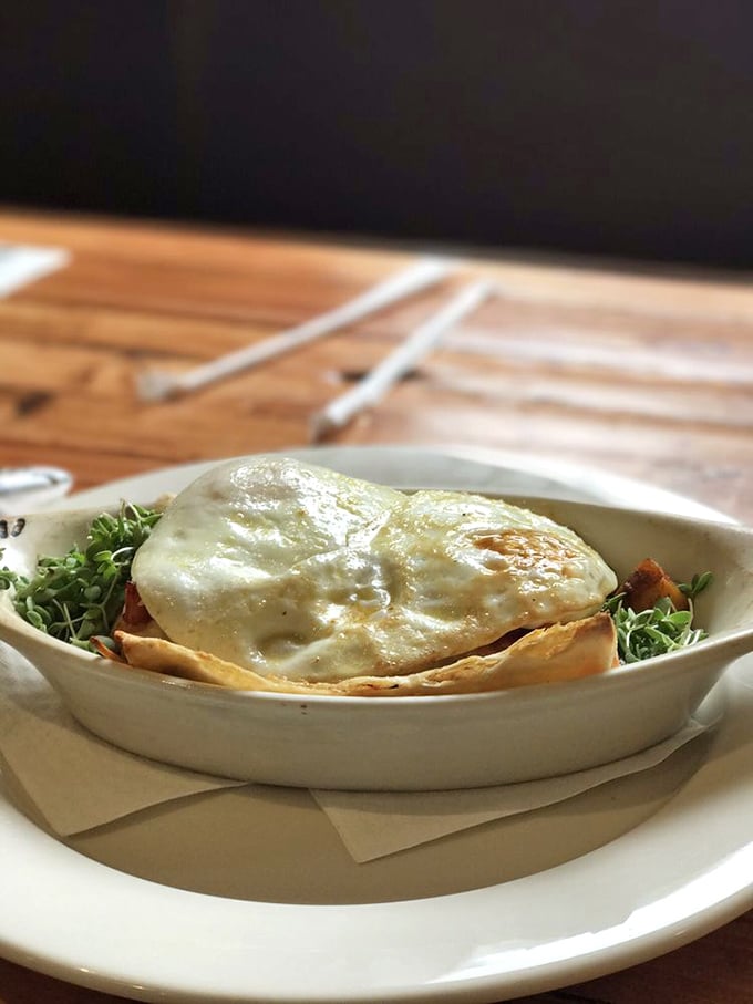 Breakfast goes formal evening wear—a perfectly melted cheese blanket draped over what might be the most photogenic breakfast creation in Pennsylvania.